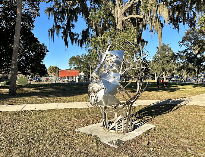 The welcoming entrance to Tuscawilla Art Park, where a stone sign hints at the artistic wonders waiting beyond, inviting curious souls to explore.