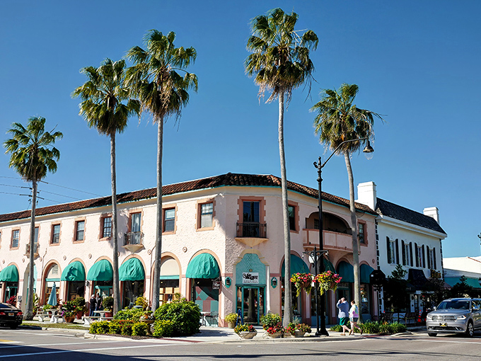 Venice's historic downtown welcomes visitors with Mediterranean charm and palm trees standing tall against the brilliant blue Florida sky.