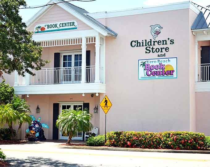The charming pink exterior of Vero Beach Book Center welcomes bibliophiles with its coastal charm and promise of literary treasures within.