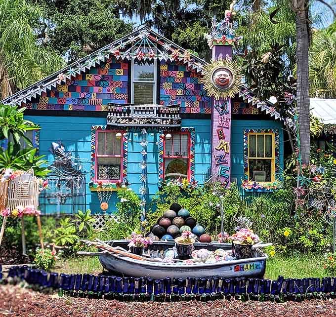 Whimzeyland's turquoise facade bursts with mosaic magic, like a kaleidoscope that decided to settle down and become a house.
