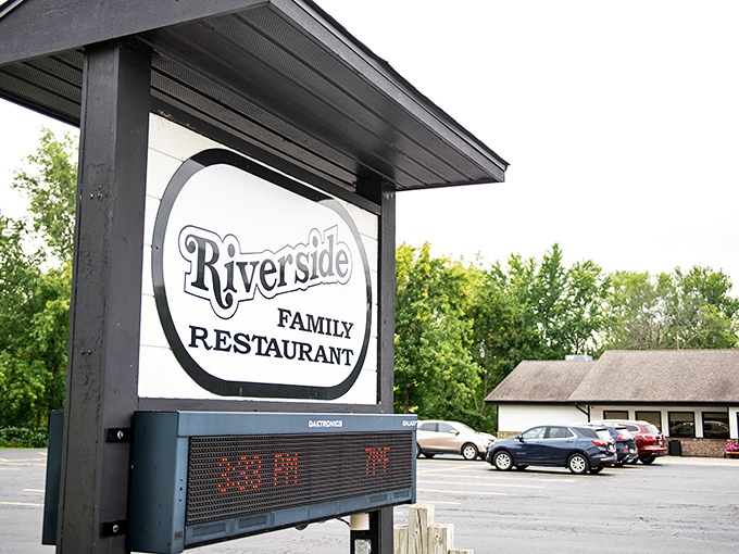 The welcoming Riverside Family Restaurant sign stands proudly against Michigan greenery, promising homestyle comfort just beyond those doors.