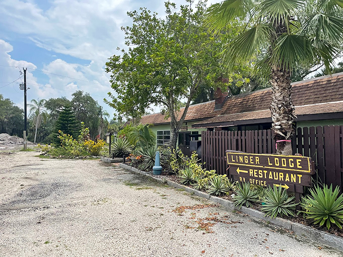 The unassuming entrance to Linger Lodge beckons adventurous diners with rustic charm and the promise of Florida's most eccentric dining experience.