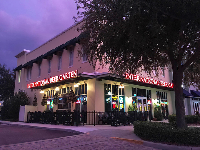The International Beer Garten's glowing façade by night – a beacon for thirsty travelers and the perfect camouflage for what lies within.