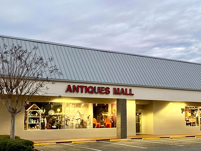 The unassuming exterior of Orange Tree Antiques Mall hides a universe of vintage treasures within, like a time-travel portal disguised as a strip mall storefront.