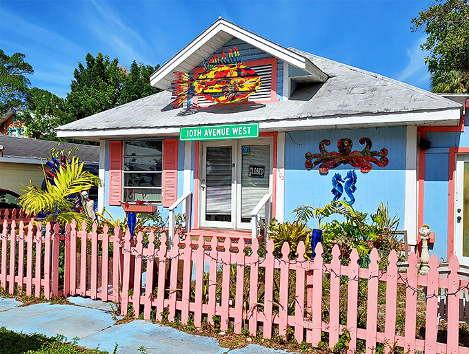 Pink picket fences frame this artistic cottage &ndash; proving even the most traditional elements can join the color revolution.