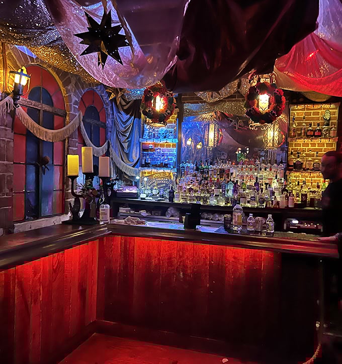 The bar area glows with an otherworldly ambiance, bottles backlit like magical potions while bartenders craft drinks with the precision of alchemists.