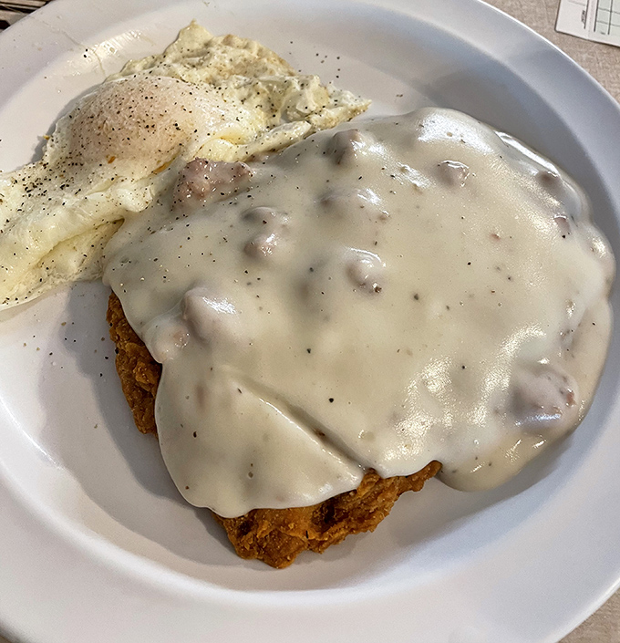 Country biscuits smothered in creamy sausage gravy &ndash; the breakfast of champions and the cure for whatever ailed you the night before.