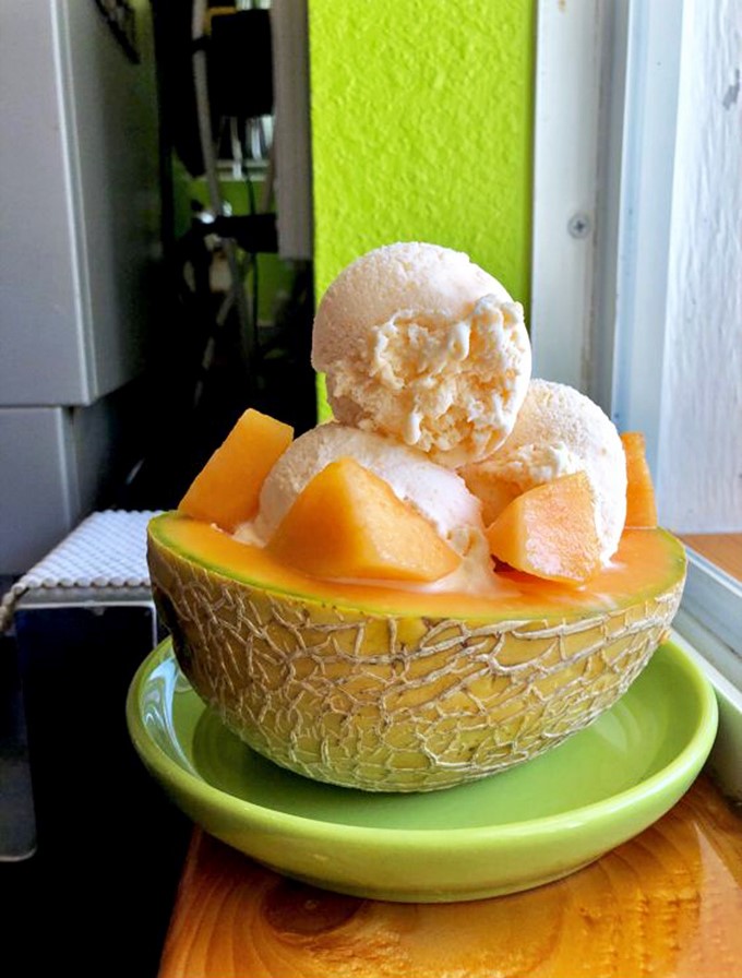 Nature's perfect bowl &ndash; cantaloupe cradles scoops of vanilla ice cream in a refreshing partnership that screams "Florida summer."