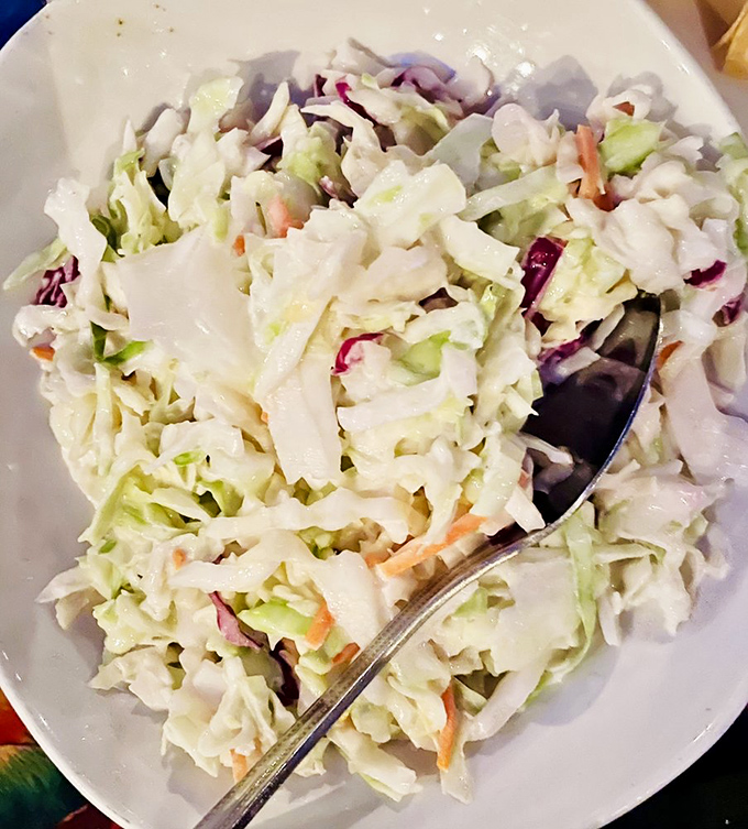 A simple coleslaw elevated to side dish stardom &ndash; crisp, creamy, and the perfect cooling counterpoint to the restaurant's more adventurous offerings.