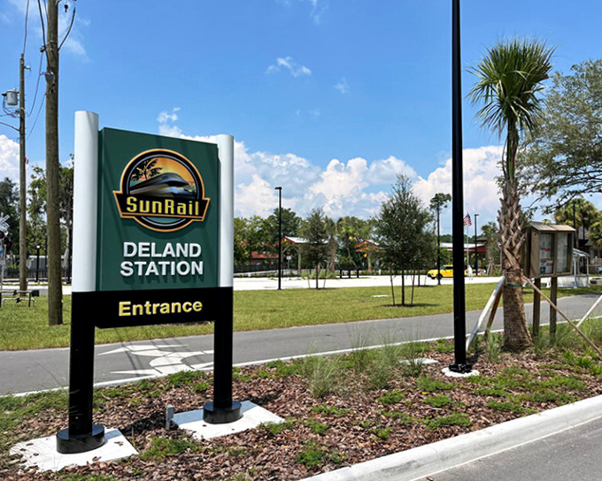 The welcoming sign at DeLand Station marks one of SunRail's newest destinations, expanding the system's reach into Volusia County's historic communities.