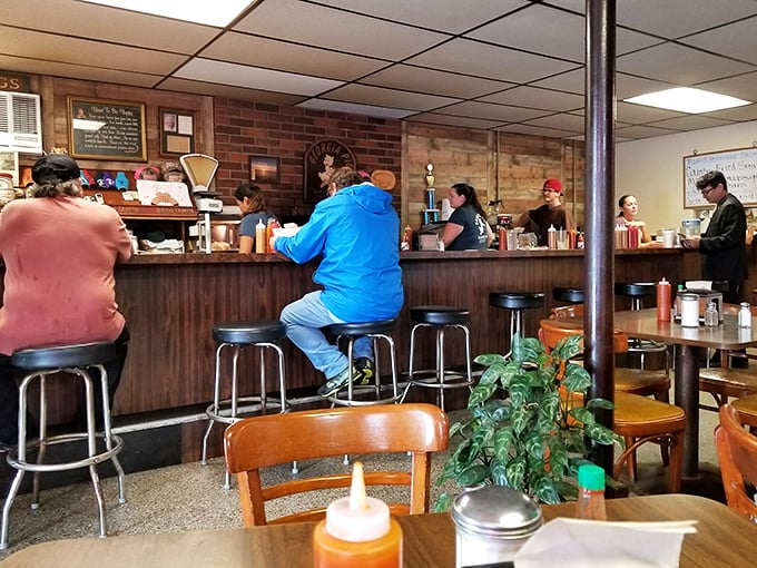 The counter where regulars gather &ndash; a front-row seat to the daily rhythm of a beloved local institution.