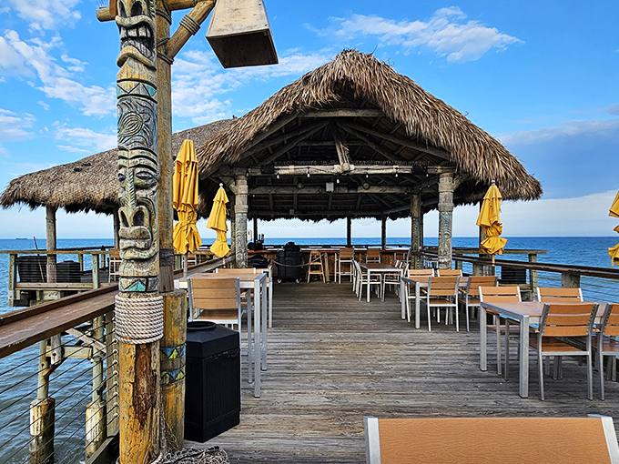 The approach to Rikki Tiki Tavern feels like discovering a secret &ndash; tables waiting at the end of the pier, yellow umbrellas standing guard against too much paradise.