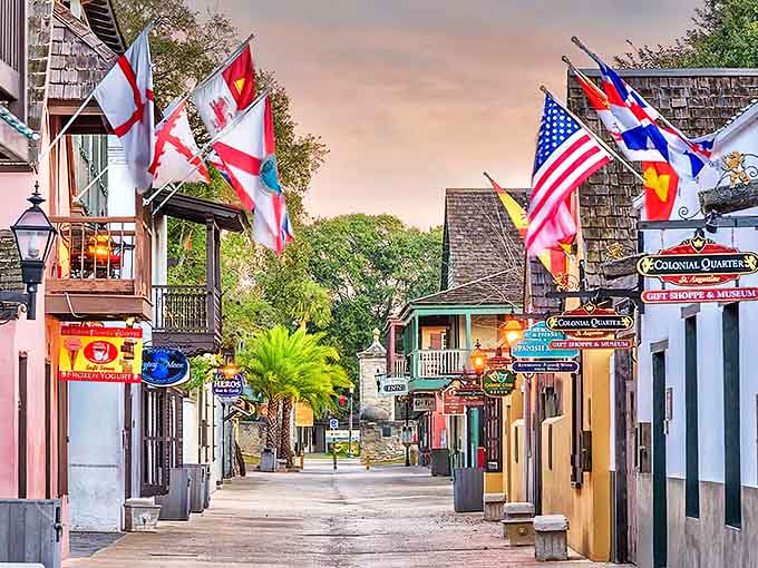 Colorful streets lined with international flags celebrate the many cultures that shaped this remarkable city over centuries.