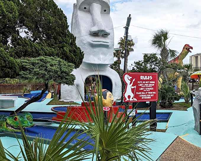 The stoic Easter Island head watches your putting attempts with ancient wisdom, judging your form with its timeless stone gaze.