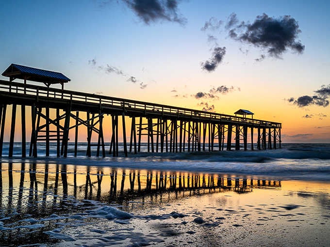 The marina boardwalk invites leisurely strolls where fishing boats and luxury yachts create an unexpected maritime democracy.
