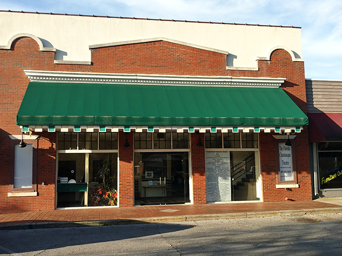The Florida Chautauqua Theatre's classic brick fa&ccedil;ade and green awning hint at cultural experiences that have enriched the community for decades.