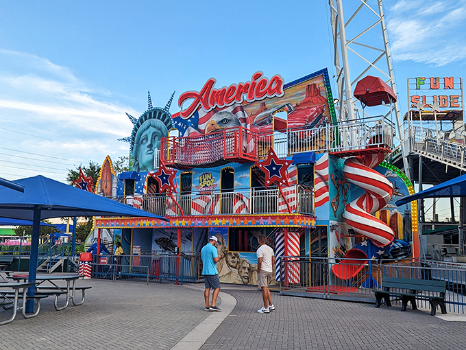 The America-themed fun house celebrates patriotism with a side of wacky mirrors – because nothing says "USA" like seeing yourself with a stretched neck.