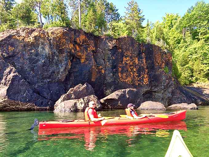 Kayaking around Black Rocks offers water-level views of Marquette's dramatic shoreline &ndash; paddling through postcard-worthy scenery that changes with every stroke.