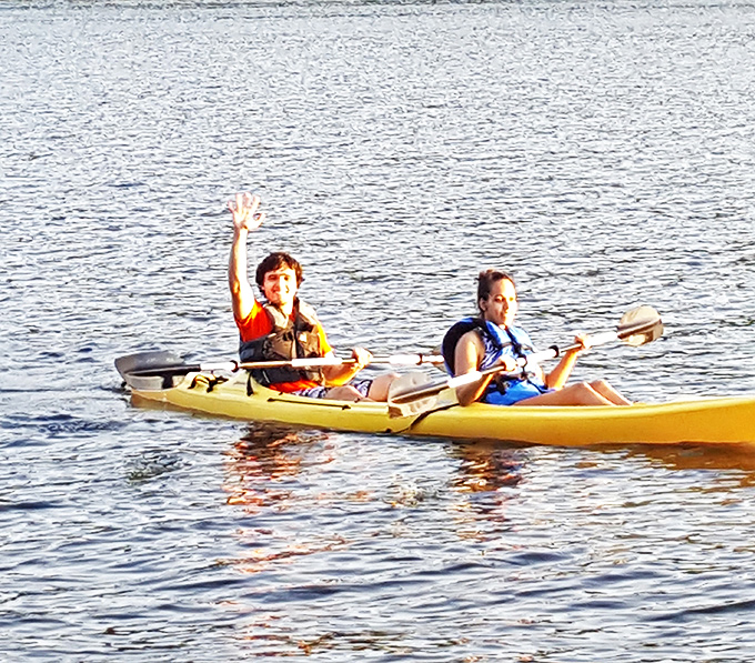 Kayakers enjoy Hancock's pristine waters, where paddling adventures and breathtaking views come standard with every stroke.