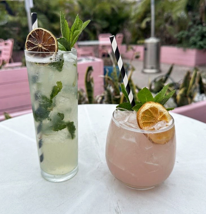 Fresh mint, citrus, and crushed ice create the perfect tropical refreshment, served in glasses that showcase the bartender's attention to detail.