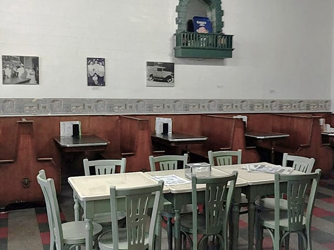 Other Interior Angle: Mint-green chairs against wooden booths create the perfect stage for ice cream drama to unfold in this vintage setting.