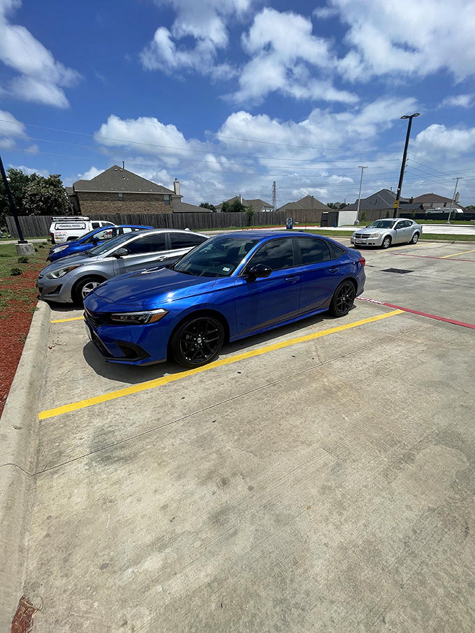 A visitor studies the intricate details of the parking area, where every corner is thoughtfully designed for convenience and ease.