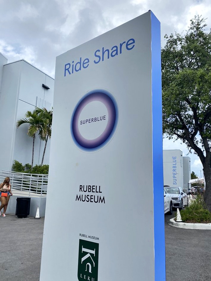 The rideshare sign outside Superblue: where drivers pick up passengers who can't quite explain what they just experienced but can't stop smiling about it.