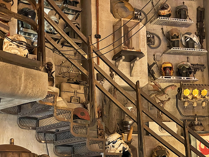 Staircases adorned with salvaged parts lead to new discoveries, with every shelf and corner holding some unexpected galactic treasure.