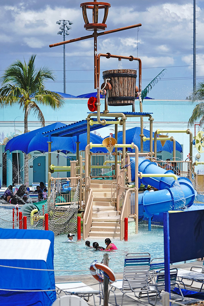 This towering water feature dumps gallons of surprise on unsuspecting guests below, creating the world's most refreshing practical joke.