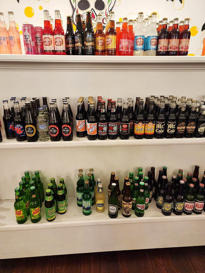 Vintage sodas line the shelves like liquid nostalgia in glass bottles. Flavors your grandparents would recognize!