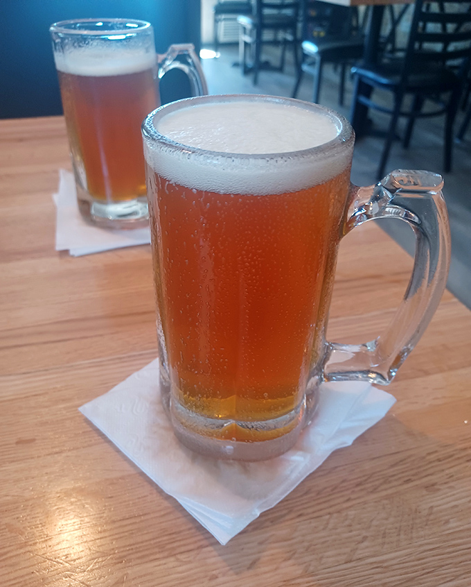 Beverages: Frosty mugs of beer catching the light like amber jewels &ndash; because nothing complements Italian-American classics quite like a perfectly poured cold one.