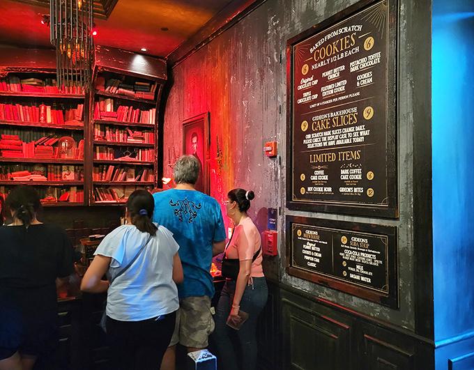 Customers navigate the menu like treasure hunters, plotting their sweet strategy while surrounded by Victorian literary vibes.