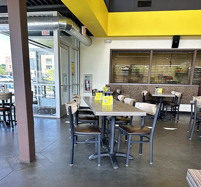 Modern industrial meets cozy comfort in this dining space where strangers become friends over the shared language of exceptional food.