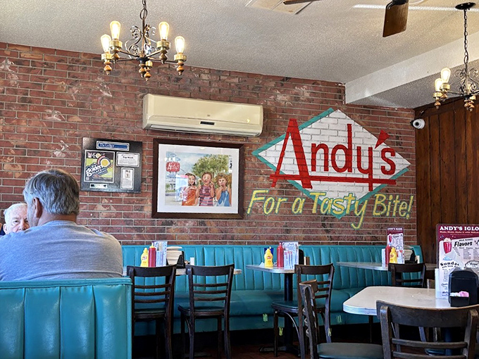 The brick wall proudly displays the Andy's logo like a family crest. Those turquoise booths have supported generations of Winter Haven residents through countless meals.