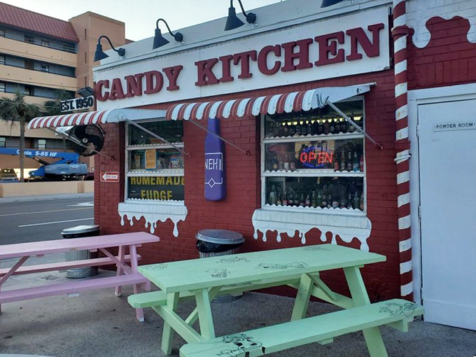 The iconic storefront practically dares you not to stop, with its cheerful picnic tables promising a perfect spot for sugar-fueled conversations.