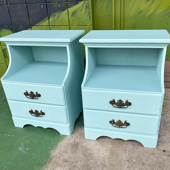 Mint-colored nightstands that would make Wes Anderson weep with symmetrical joy, ready to elevate any bedroom's retro credentials.