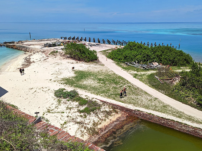 White sand shores encircle the massive fort, offering perfect swimming spots between history lessons.