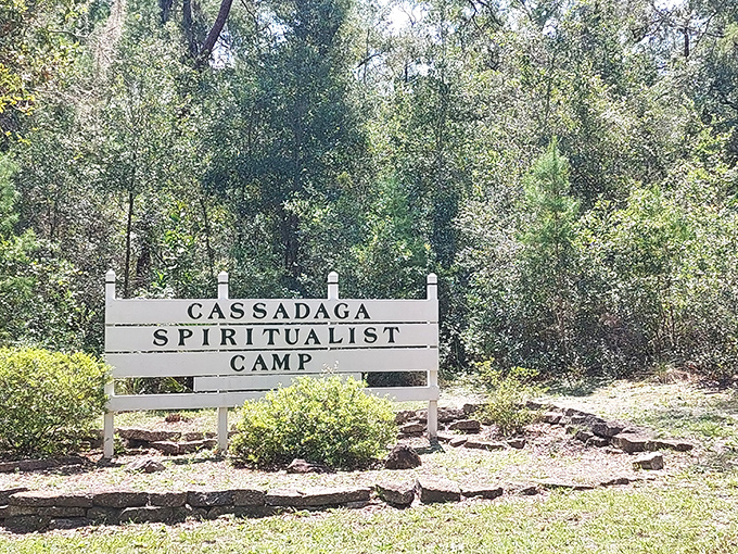 The camp's entrance sign welcomes spiritual travelers while blending perfectly with the natural surroundings &ndash; no neon required when you're guided by higher powers.