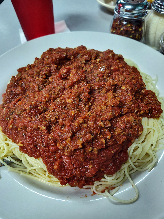 Spaghetti with meat sauce piled high enough to feed a family, or one very determined pasta enthusiast.