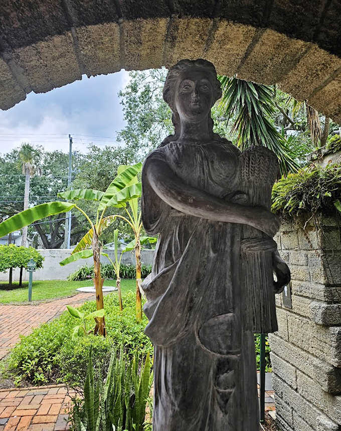 Classical statuary stands sentinel in the garden, a silent observer to the changing tides of history flowing through St. Augustine.