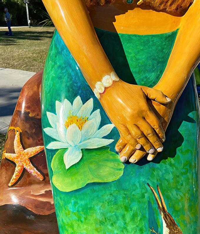 The hand-painted details include delicate flowers and perfect nails, proving these mermaids maintain better manicures than most land-dwelling humans.