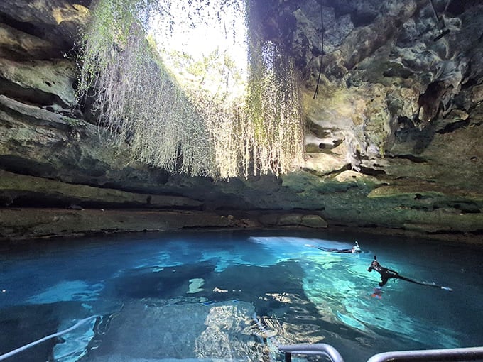 Sunlight pours through the cave opening like nature's own spotlight on the main stage.