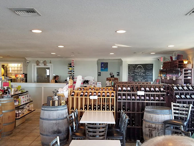 Wine racks and barrels fill this bright space where beach life meets wine culture.