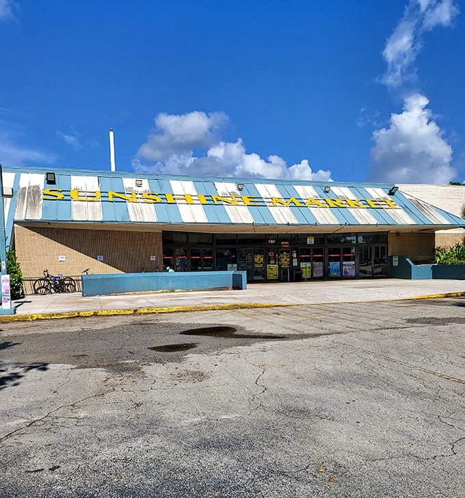 Blue stripes against blue skies! Sunshine Market's distinctive awning announces bargain central, where even the cracked parking lot can't deter dedicated treasure seekers.