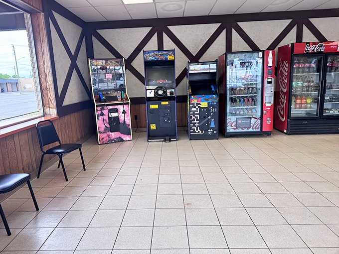 Vintage arcade games stand ready to entertain while you wait, a nostalgic touch that perfectly matches Zukin's timeless appeal.