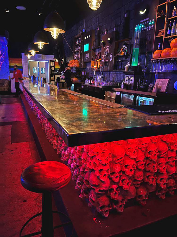 The bar at Cocktails & Screams features hundreds of glowing red skulls, creating an underworld VIP section where even the Grim Reaper might stop for a nightcap.