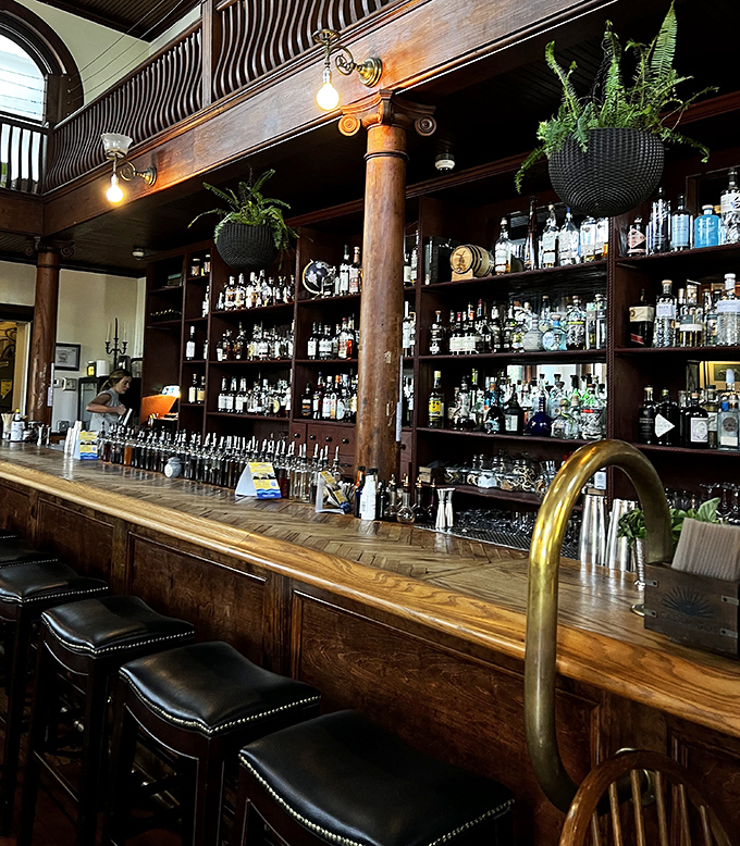 Liquid library: The magnificent wooden bar with its impressive bottle collection promises adventures in flavor for every palate and preference.