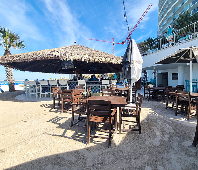 Thatched roof tiki vibes and endless ocean views &ndash; the kind of bar that makes "just one more" an easy decision.
