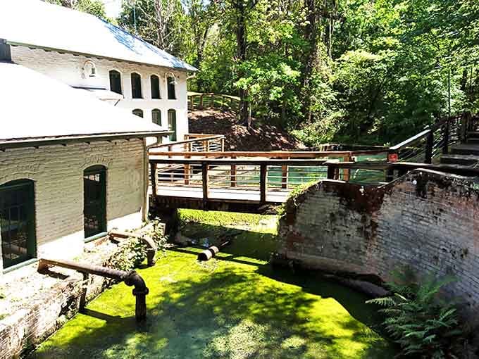 The wooden walkway creates a perfect viewing platform for examining the ingenious system that once pumped life into a growing city.