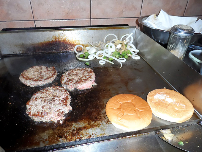 The sizzle of fresh burger patties on the flattop creates a symphony of sounds and smells that's better than any restaurant soundtrack.